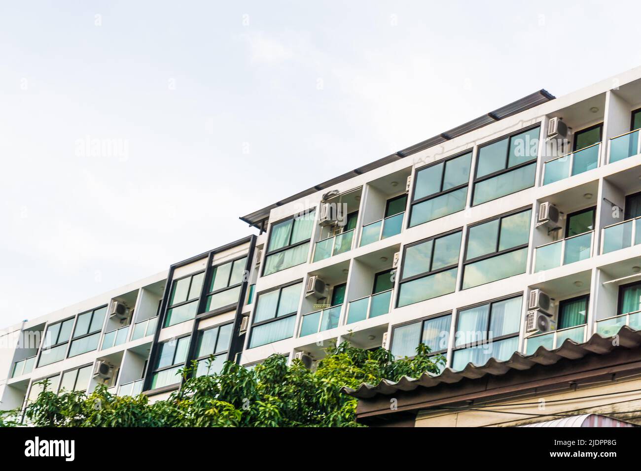 Modern real estate condominium building with blue window, Flat and ...