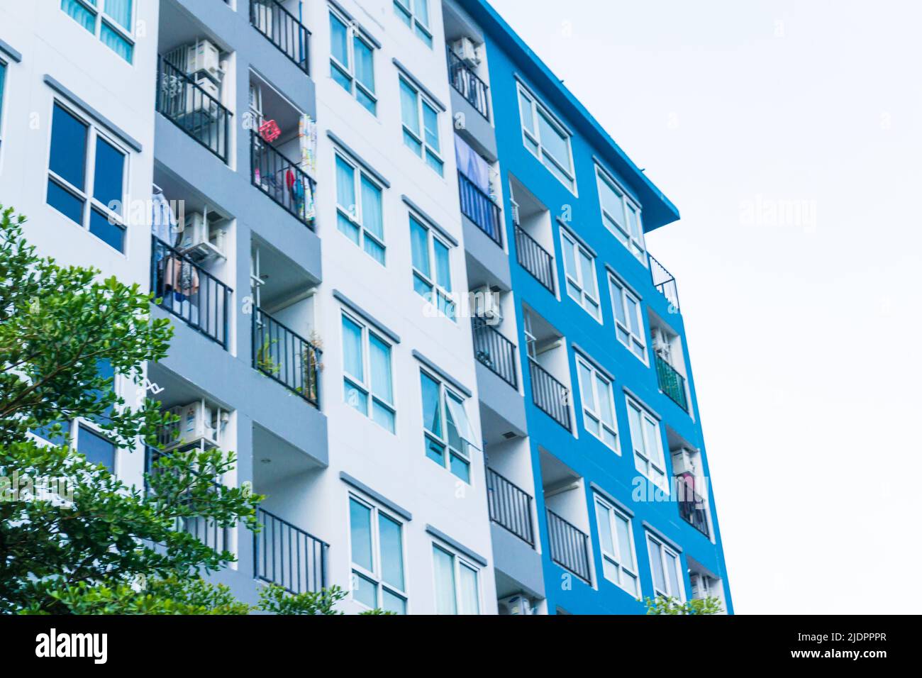 Modern real estate condominium building with blue window, Flat and ...