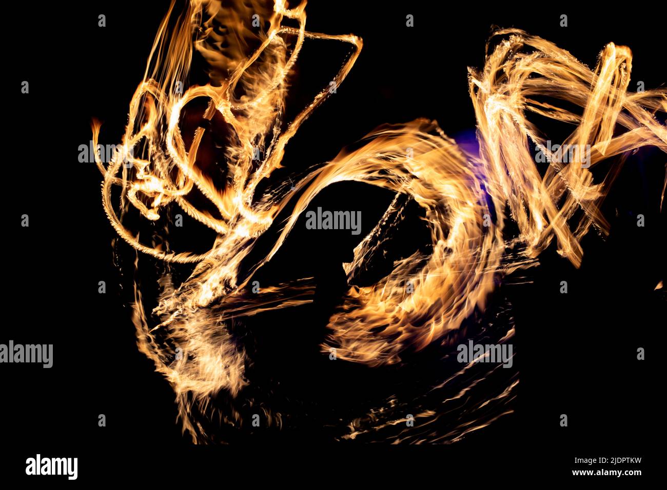 Fire in dark. Fire show at night. Chaotic flames. Lines of fire ...