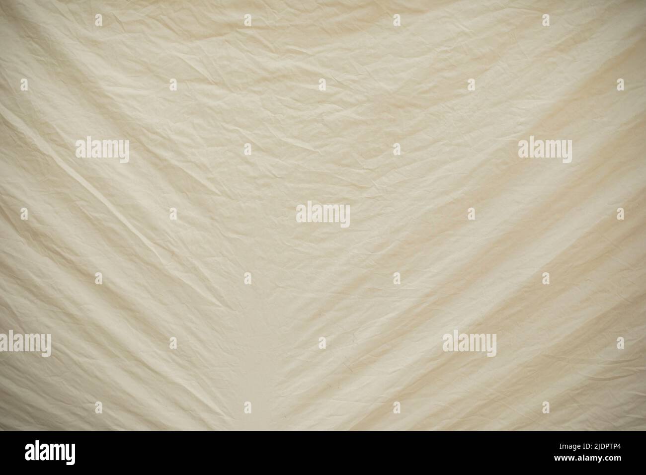 White awning with creases from tension. Texture of white fabric. Rubber ...