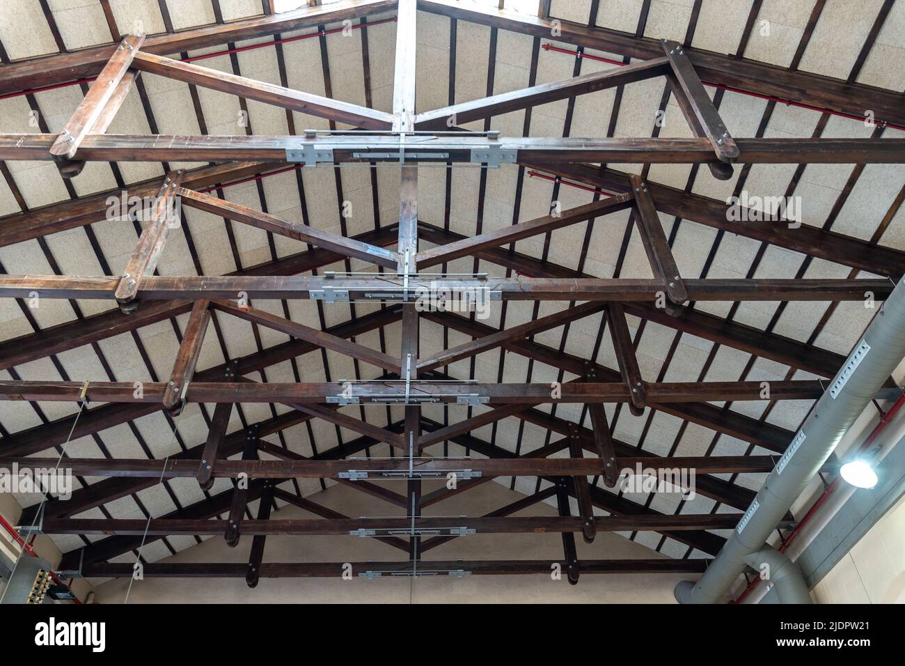 Wooden ceiling structure. Beams with bolts and metal joints Stock Photo ...