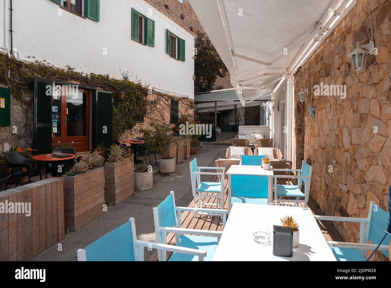 Outdoor seating of mediterranean restaurant. El fresco dining with ...