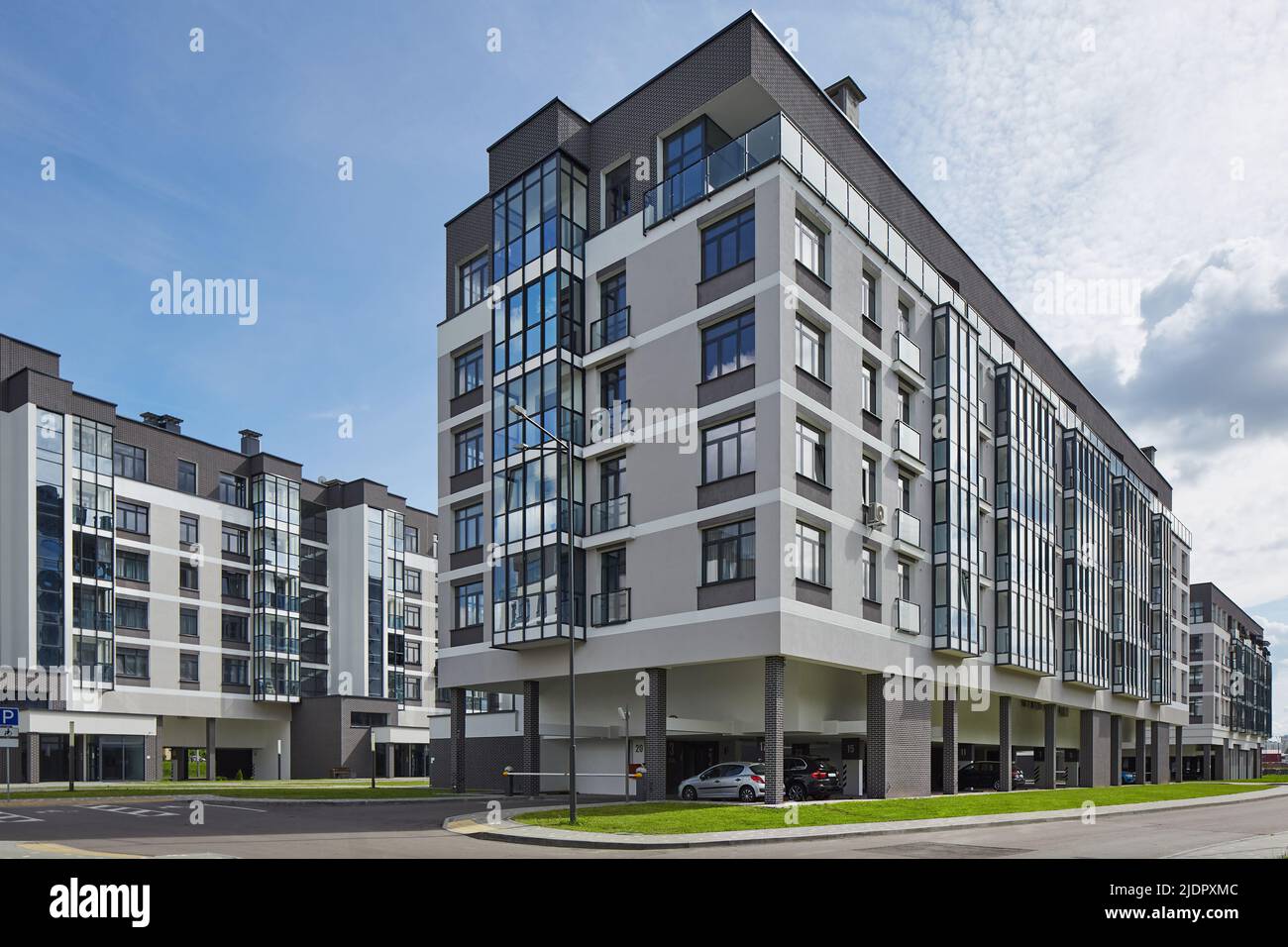 New modern block of flats in green area. residential apartment with ...