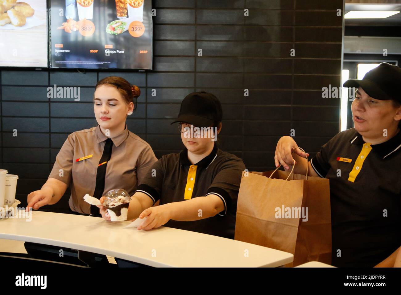 The restaurant staff serves customers. New Russian fast food chain ...