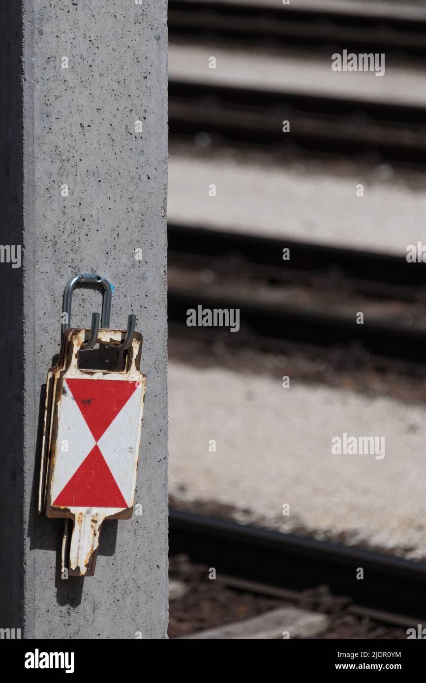 Closeup metal signal signs train end panels showing triangles in red ...