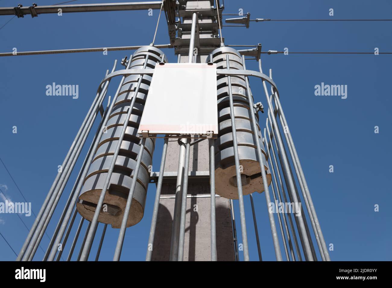 close up view from below of a concrete pole used to attach overhead ...