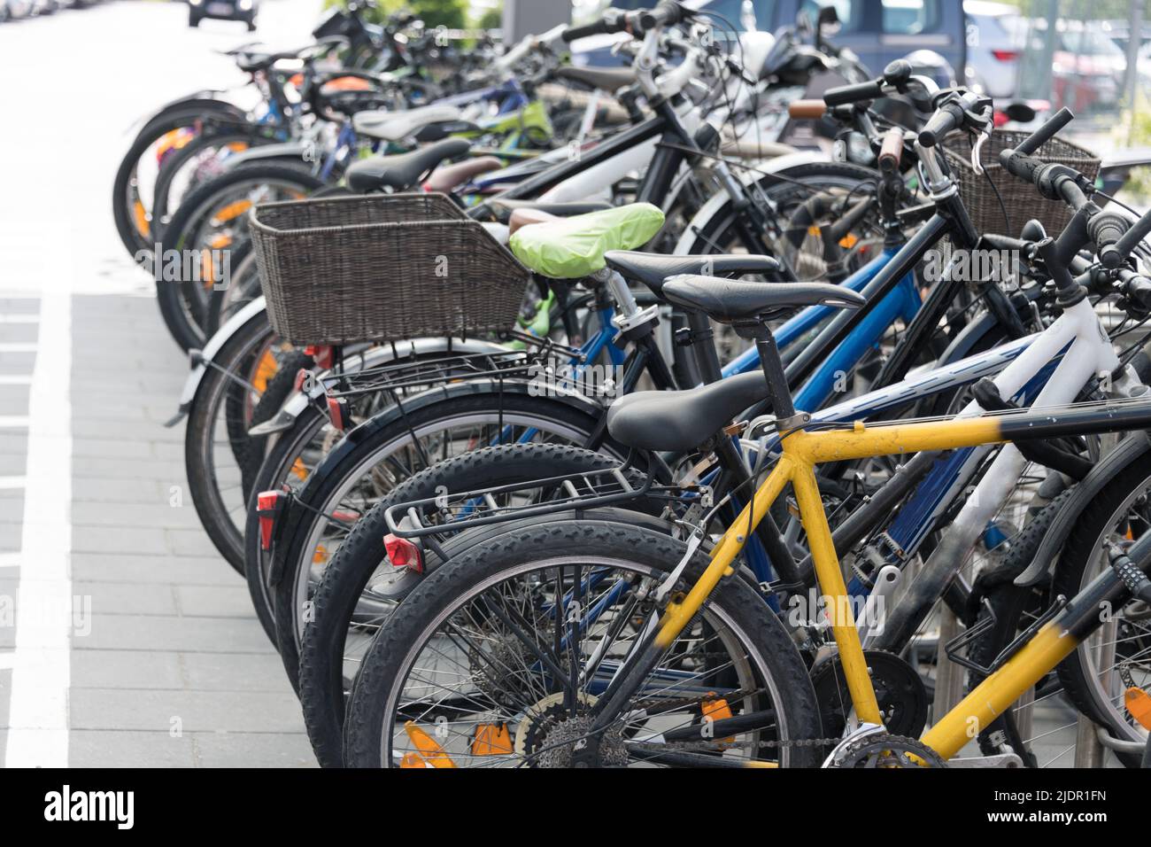 many different colorful bicycles mountainbikes parked next to each ...