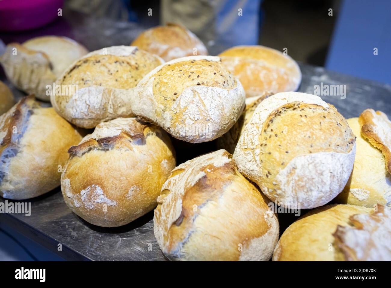 A finished batch of artisan wheat bread, just out of the oven. Front ...