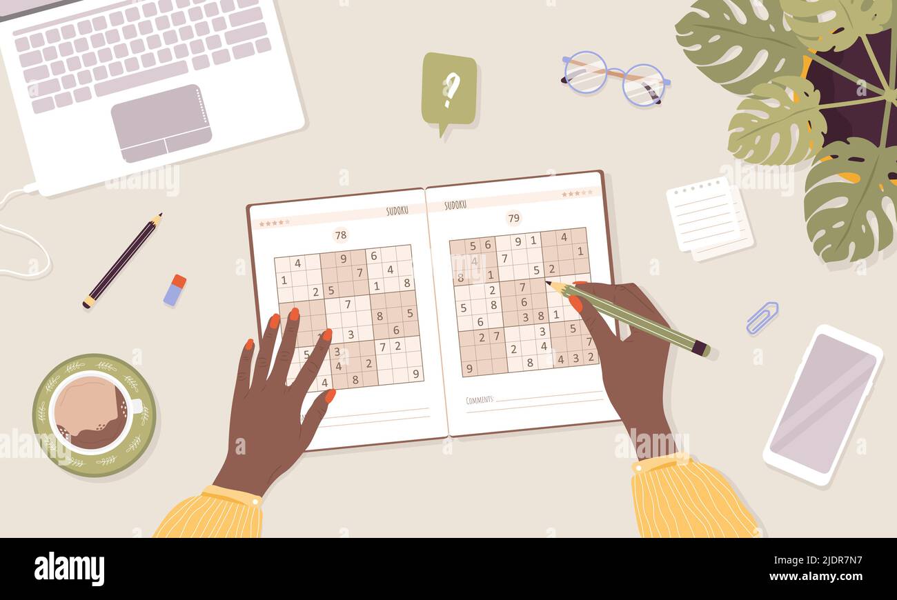 Sudoku game. Learning and leisure concept. African woman solves ...