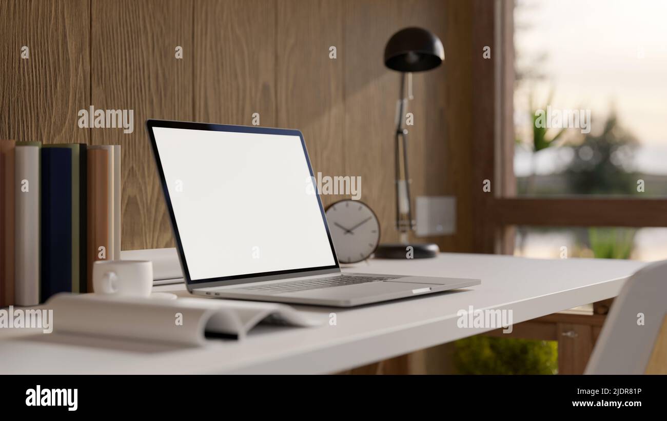 Comfortable home workspace with portable laptop computer blank screen ...