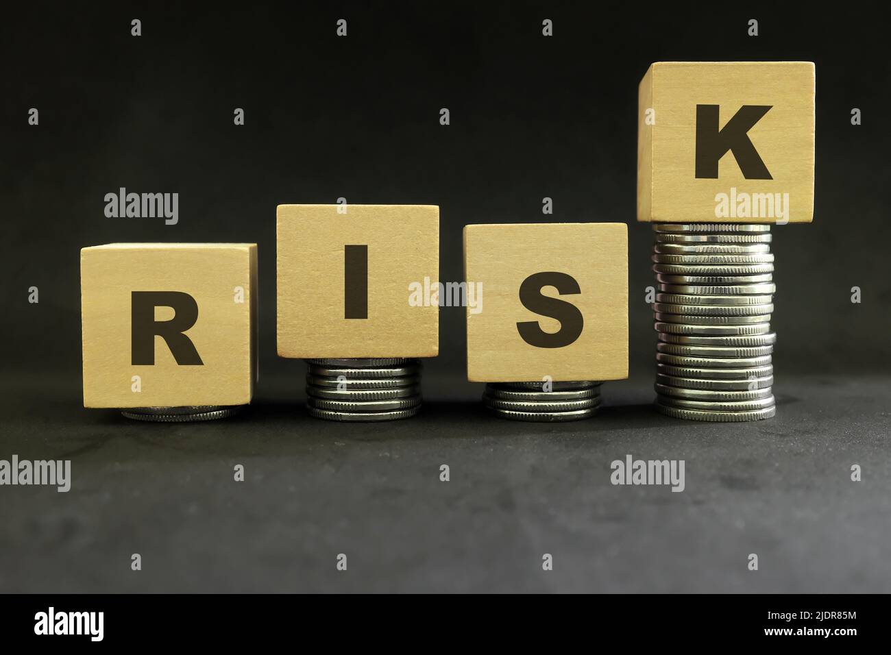 Success in risky investment and market volatility risk concept. Wooden ...