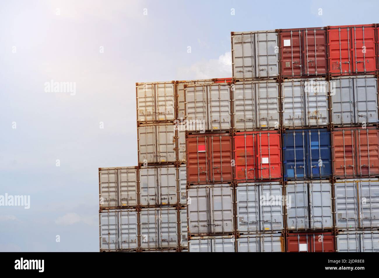 Stacking containers in the port Stock Photo - Alamy