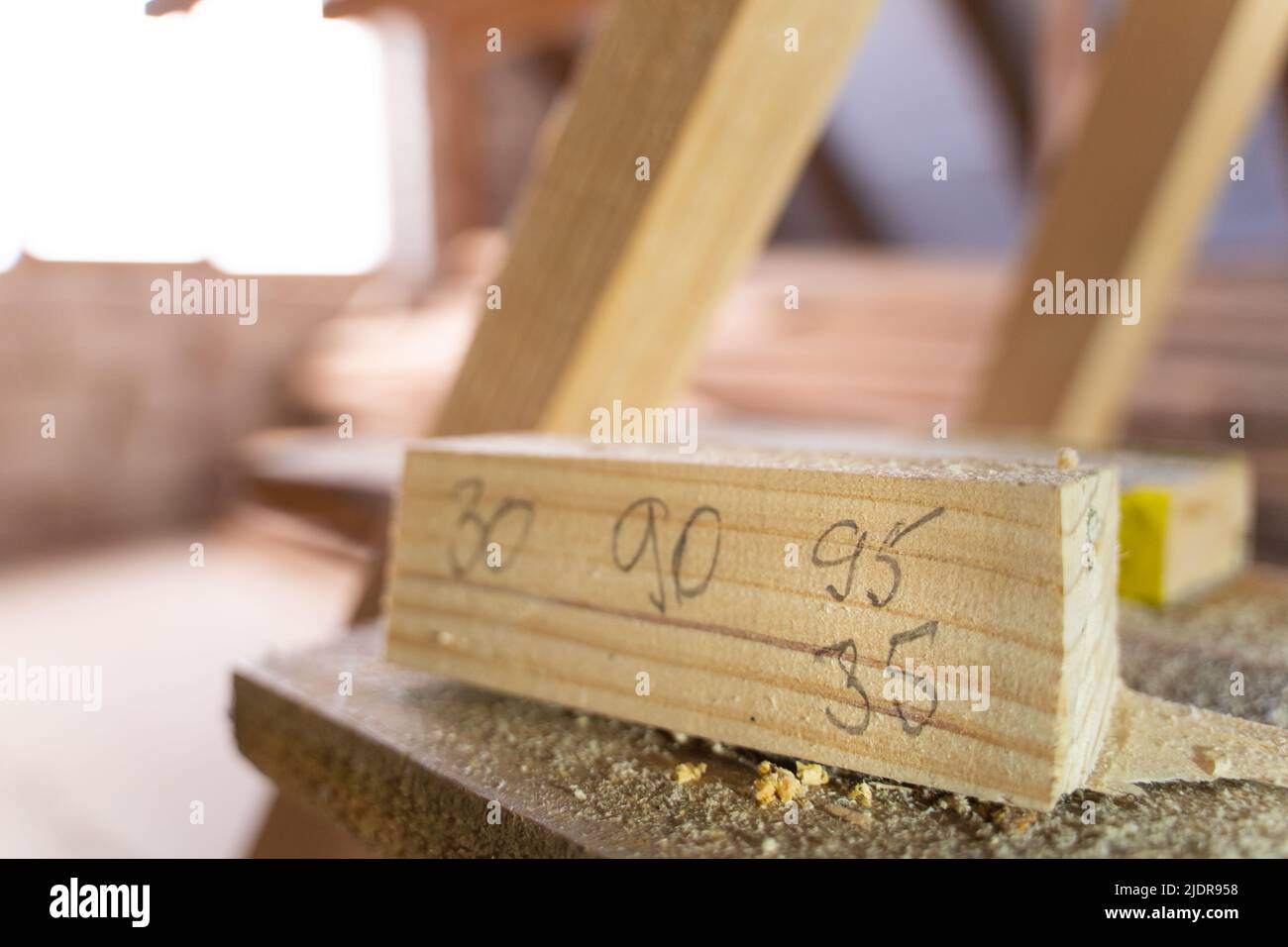 Wooden block with numbers written on it in pencil at a construction ...