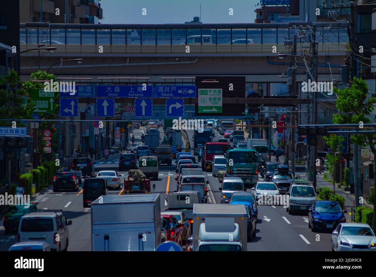 A traffic jam at the urban street in Tokyo long shot Stock Photo - Alamy