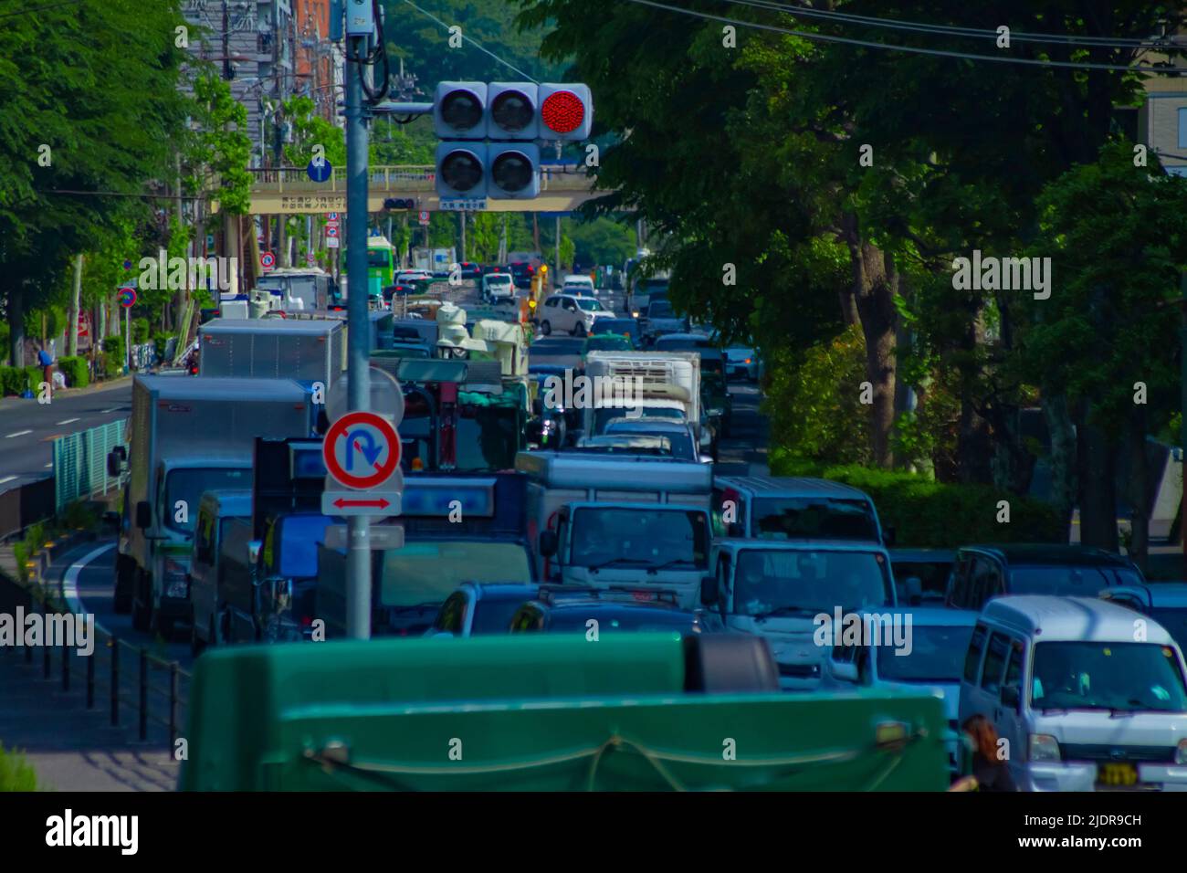 A traffic jam at the urban street in Tokyo long shot Stock Photo - Alamy