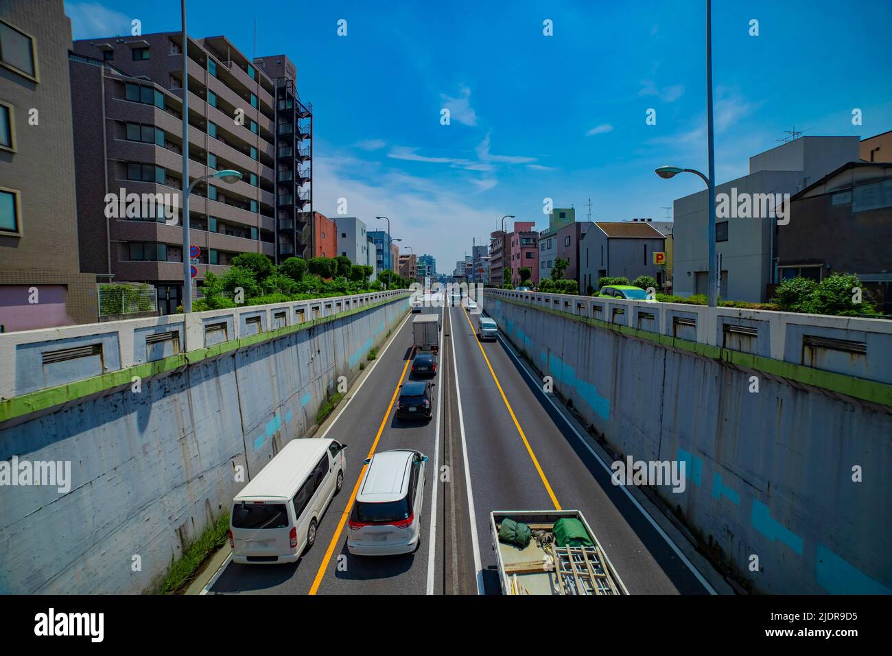 A traffic jam at the urban street in Tokyo wide shot Stock Photo - Alamy