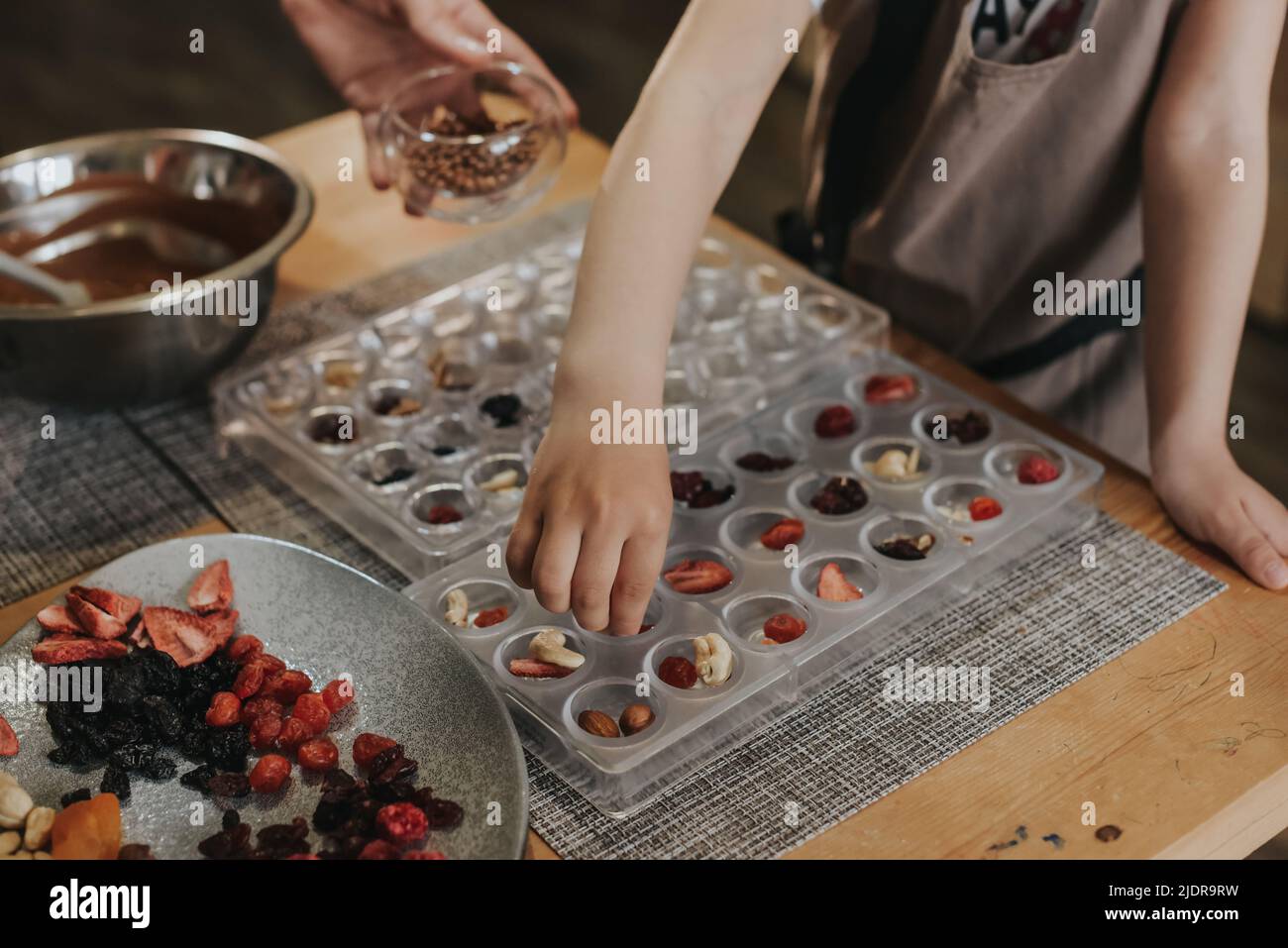 Mom and daughter make chocolate at home Stock Photo - Alamy