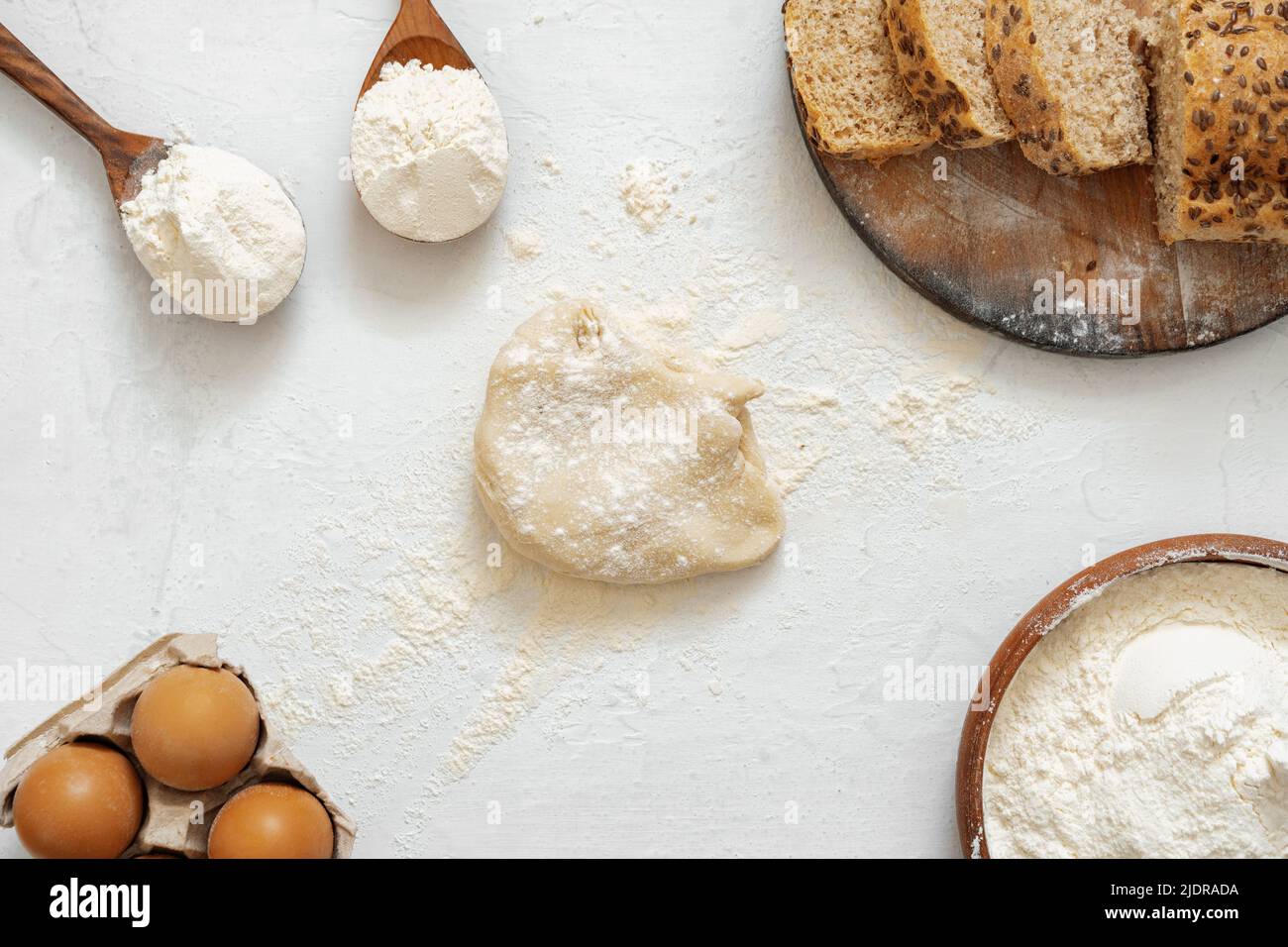 Preparation for baking. Eggs and flour on white background Stock Photo ...