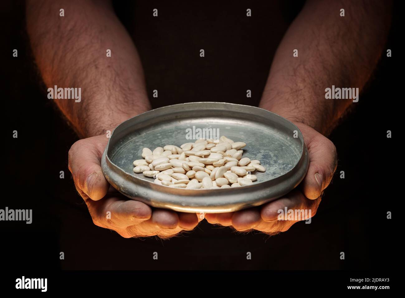 Male hands holding grains of dry kidney beans on dark background Stock ...