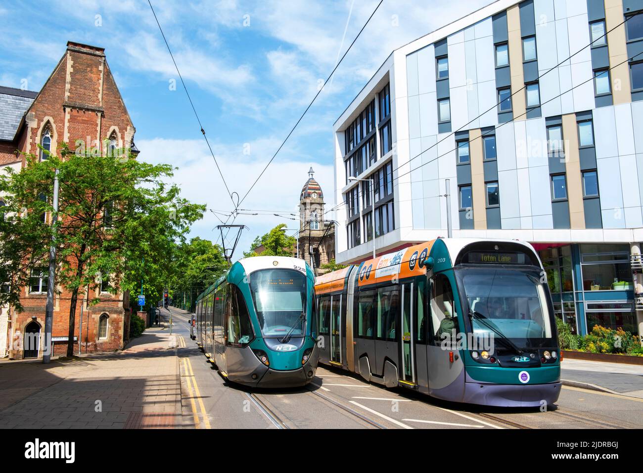 Trams side by side on Goldsmith Street in Nottingham City ...