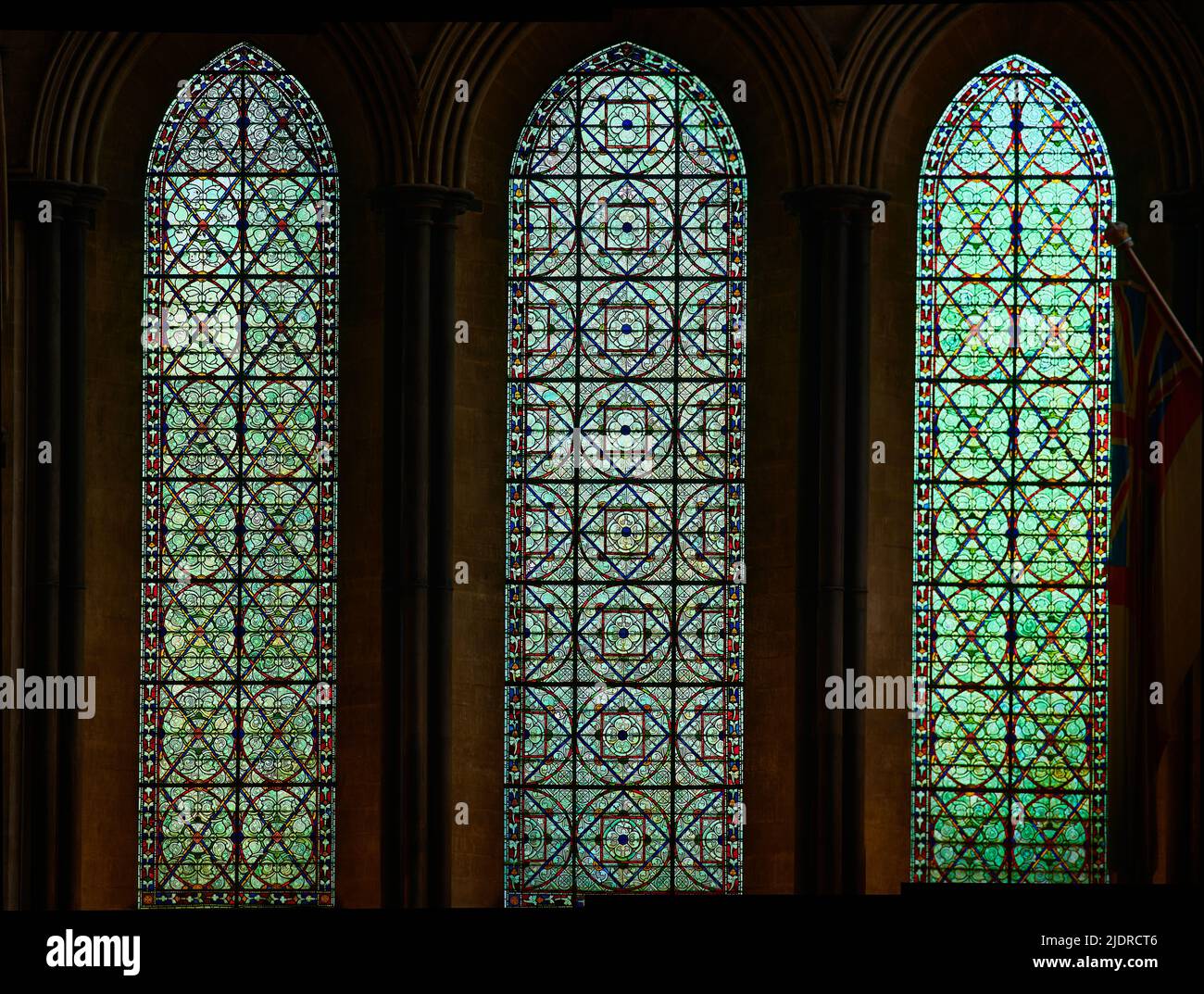 Geometric patterns in a trio of stained glass windows at the south ...