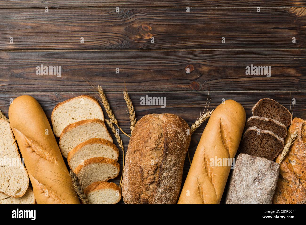 Homemade natural breads. Different kinds of fresh bread as background ...