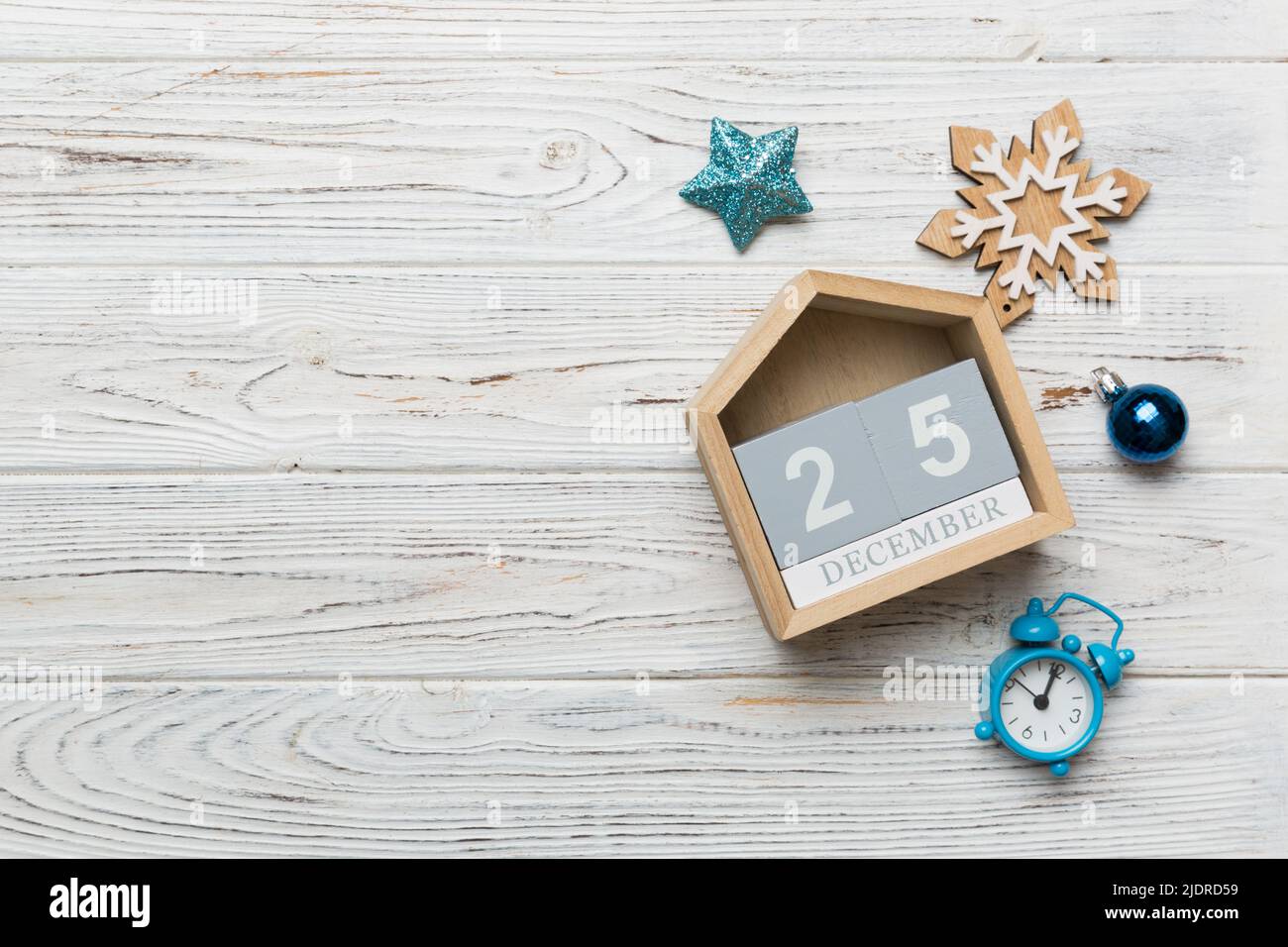 Christmas wood calendar with new year decorations, aganist colored ...
