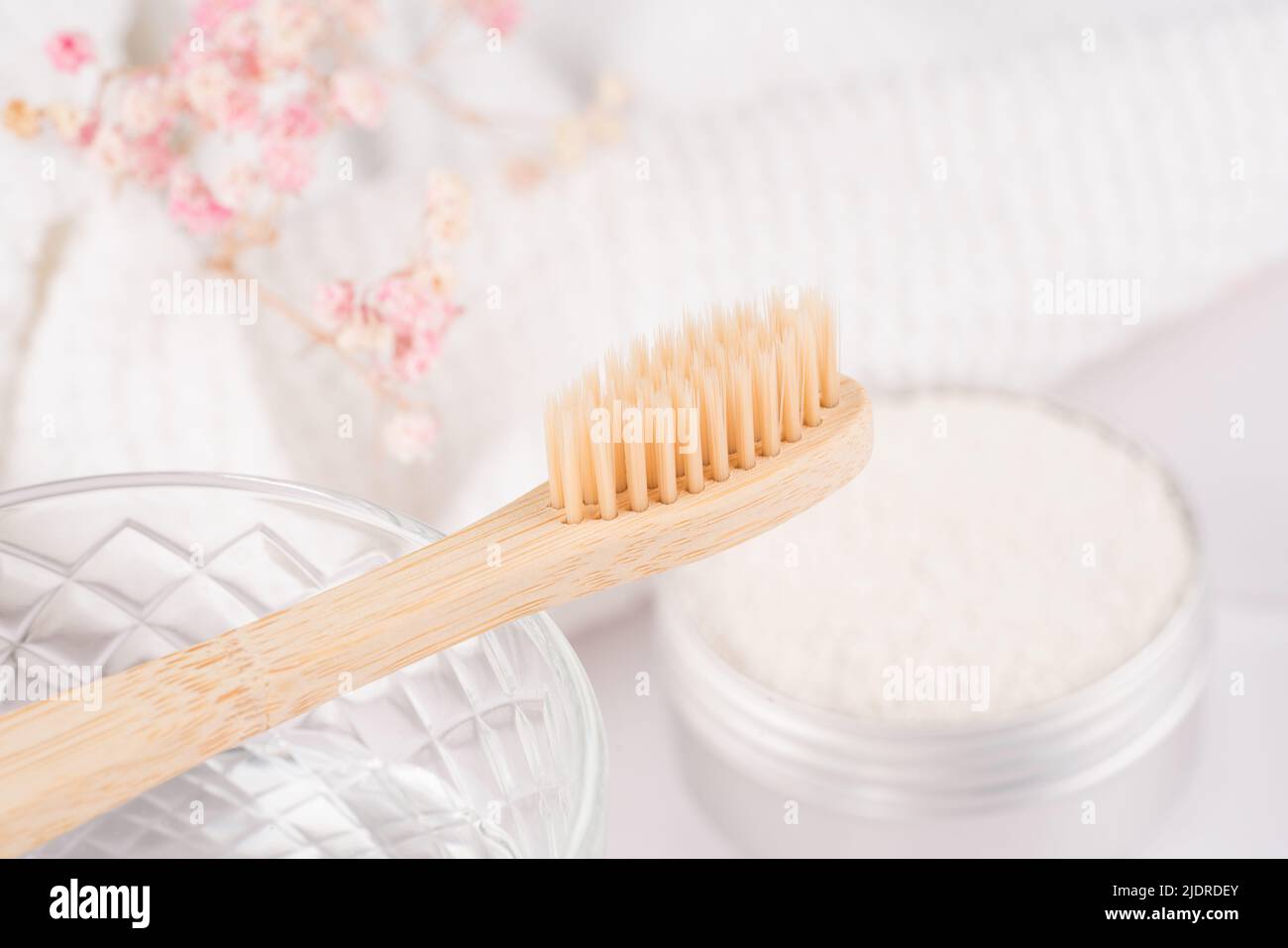 Closeup view of bamboo toothbrush with mineral toothpowder kaolin in ...