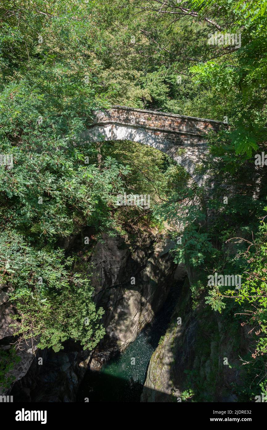 Historic arched bridge over the Orrido di Sant Anna gorge on the ...