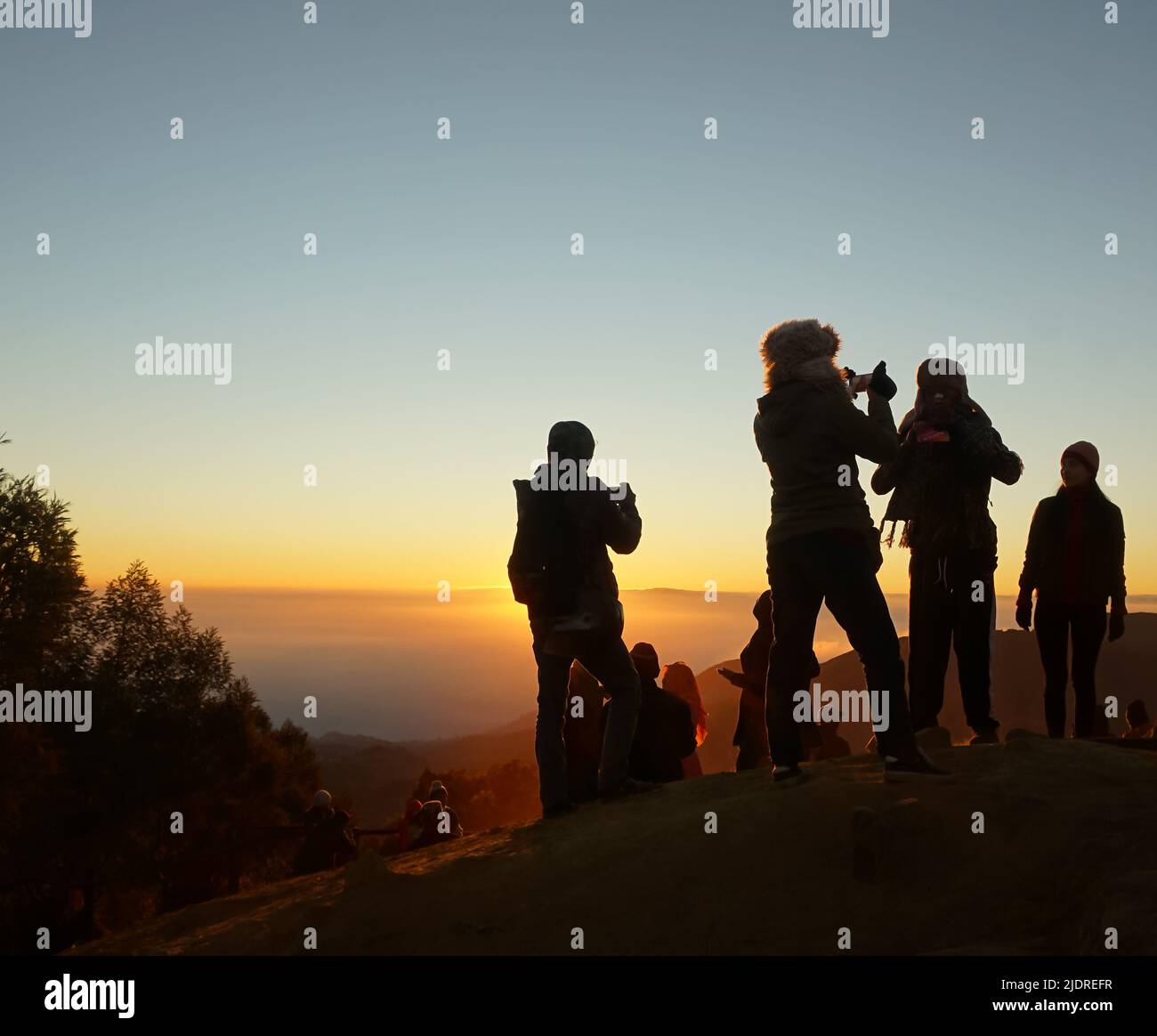 People are Enjoying Sunrise in Sikunir Hill Dieng Stock Photo - Alamy
