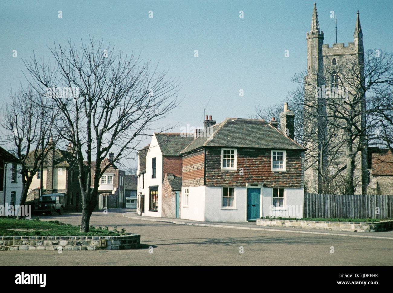Church and historic buildings in centre of village, Lydd, Kent, England ...