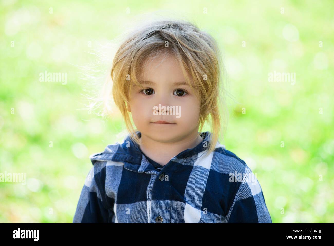 Cute little baby on the meadow field. Toddler child walking outdoor ...