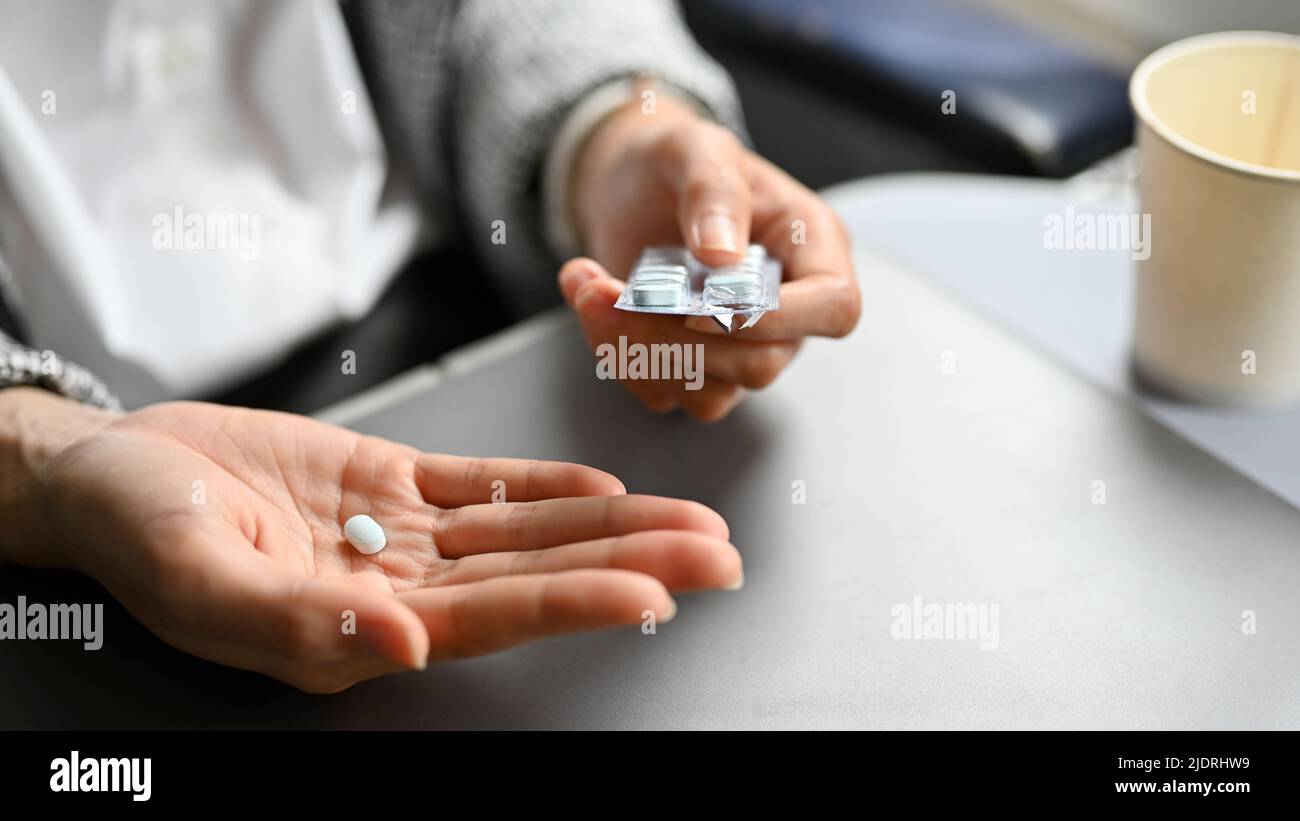 Close-up image, An airsick motion sickness pill on a female hand ...