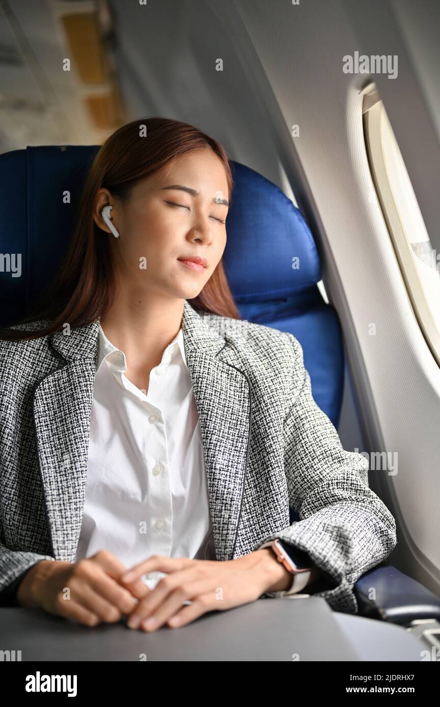 Beautiful and successful millennial asian businesswoman relaxed taking ...