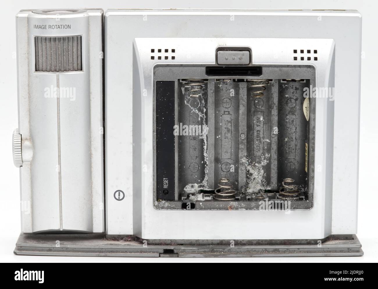 Oxide corrosion inside the battery compartment of an electronic device ...