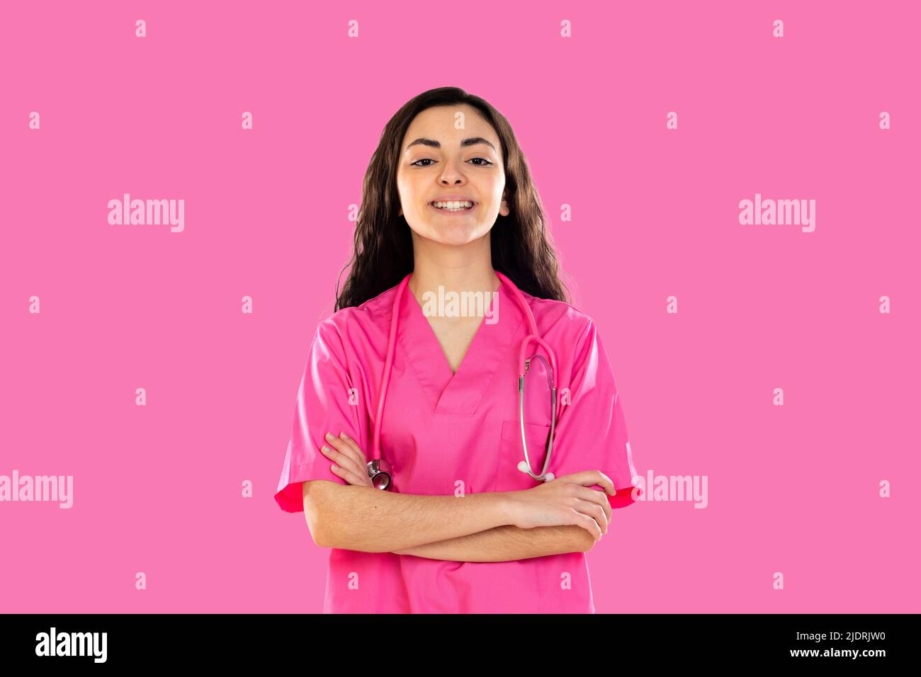 Young doctor with uniform isolated on a pink background Stock Photo - Alamy