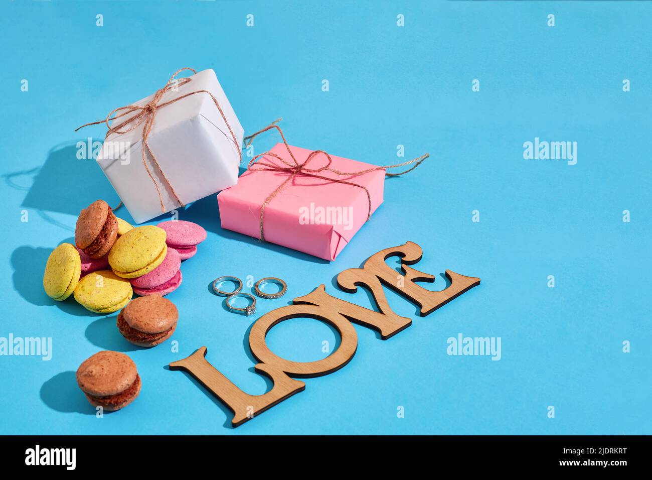 Macaroons and gift boxes on a blue background with the words I l Stock ...