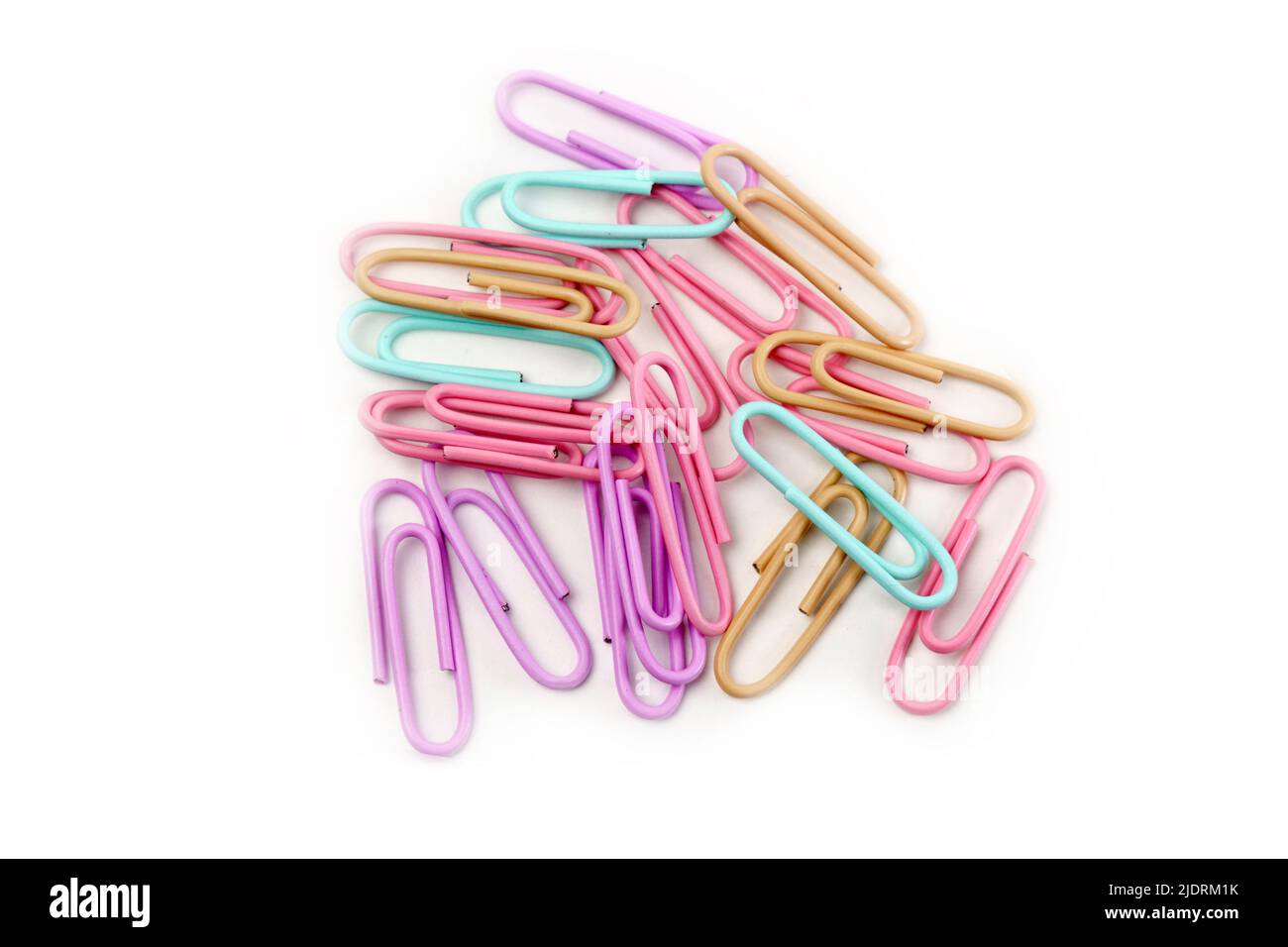 Multicolored close up paper clips isolated on a white background. Back ...
