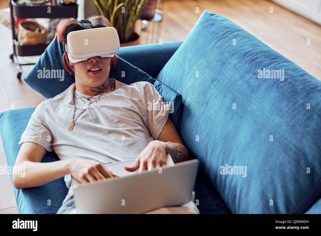 Asian man playing online game simulation at home Stock Photo - Alamy