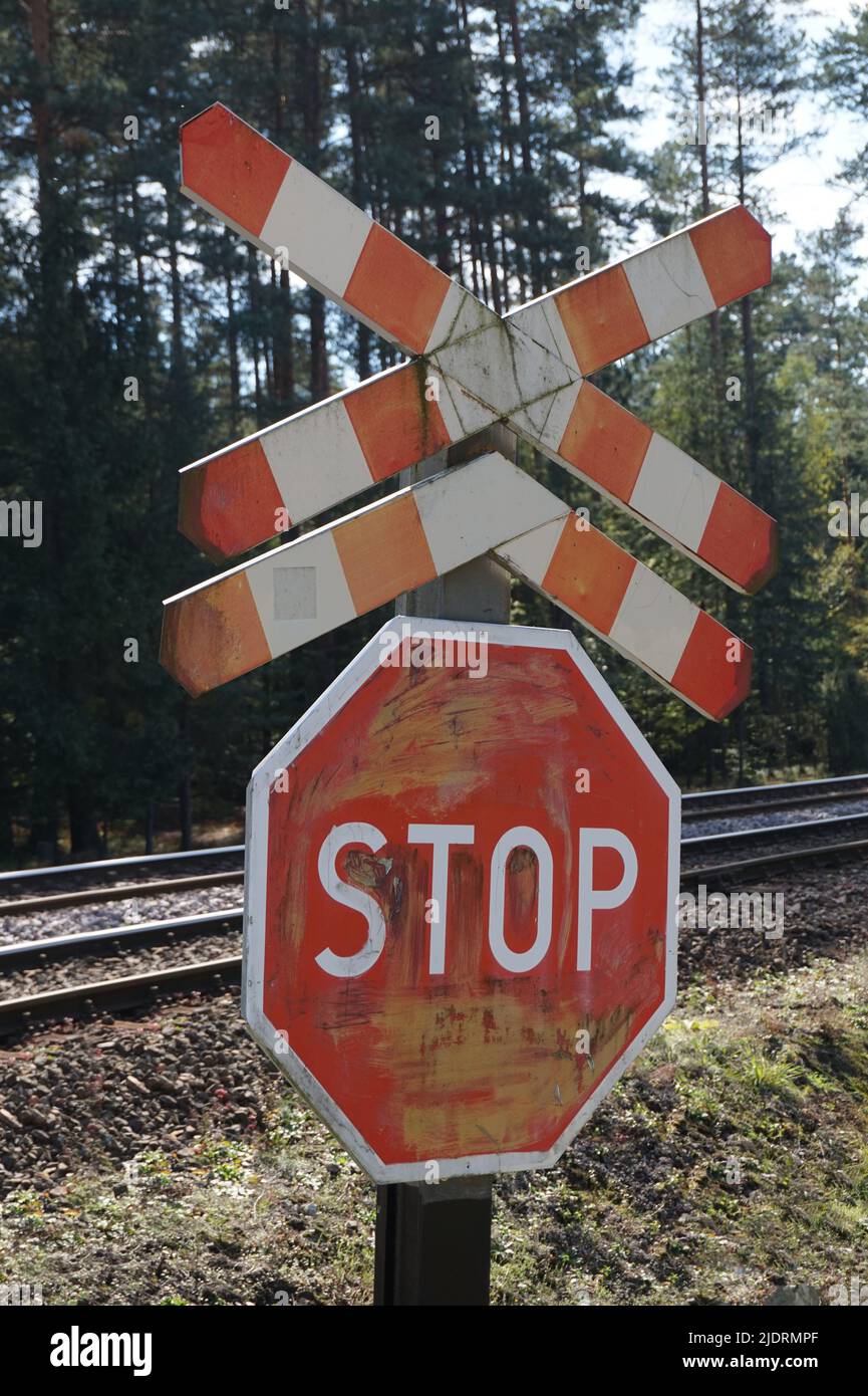 Stop sign on railroad crossing Stock Photo - Alamy