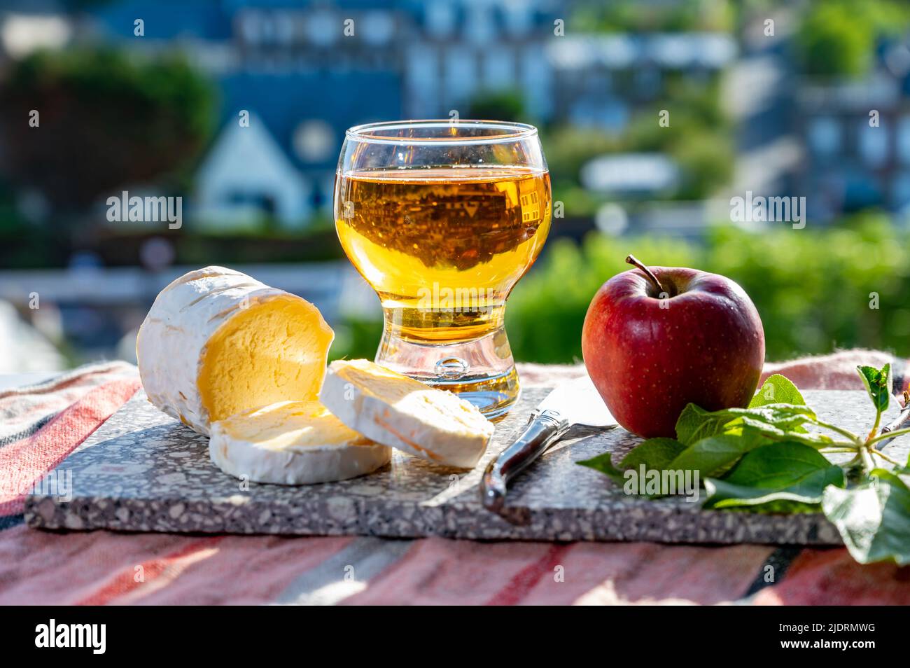 Products of Normandy, cow neufchatel lait cru cheese and glass of apple ...