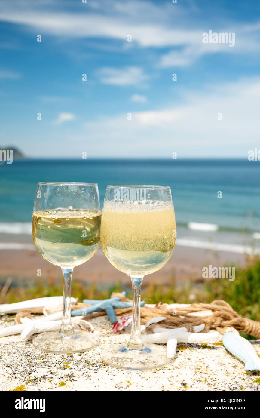 Tasting of txakoli or chacolí slightly sparkling very dry white wine ...