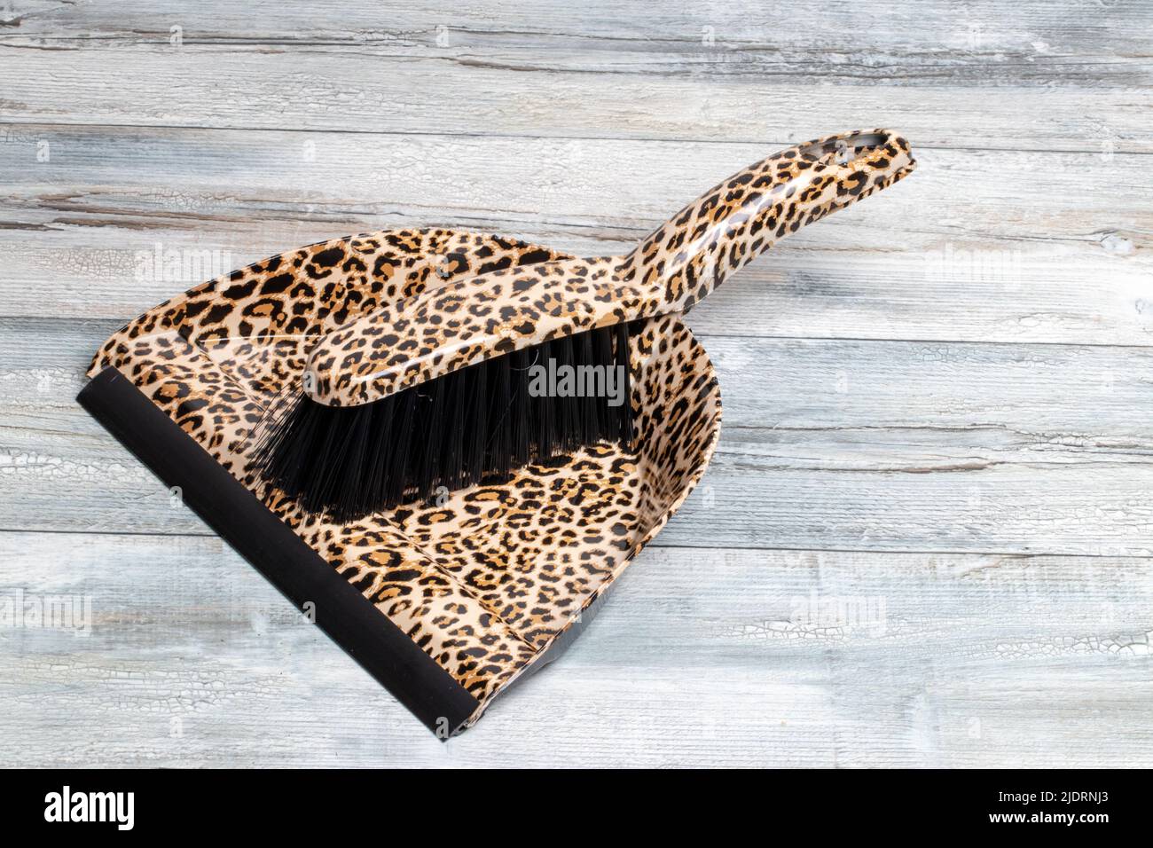 Household cleanliness and hygiene. Closeup of a Dustpan and hand brush ...