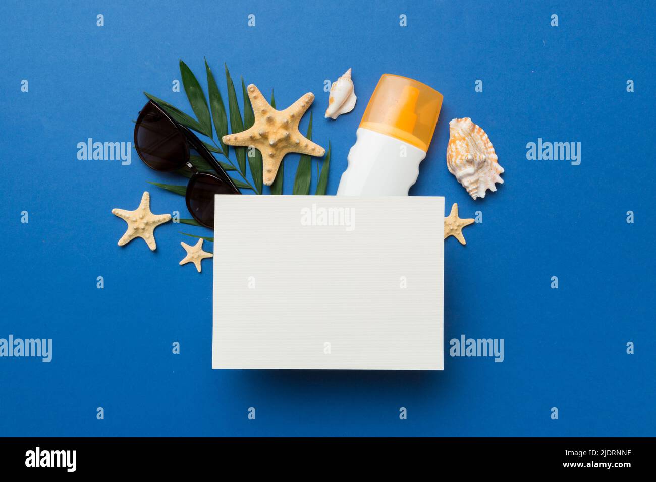 Summer time concept with blank greeting card and blank white paper on ...