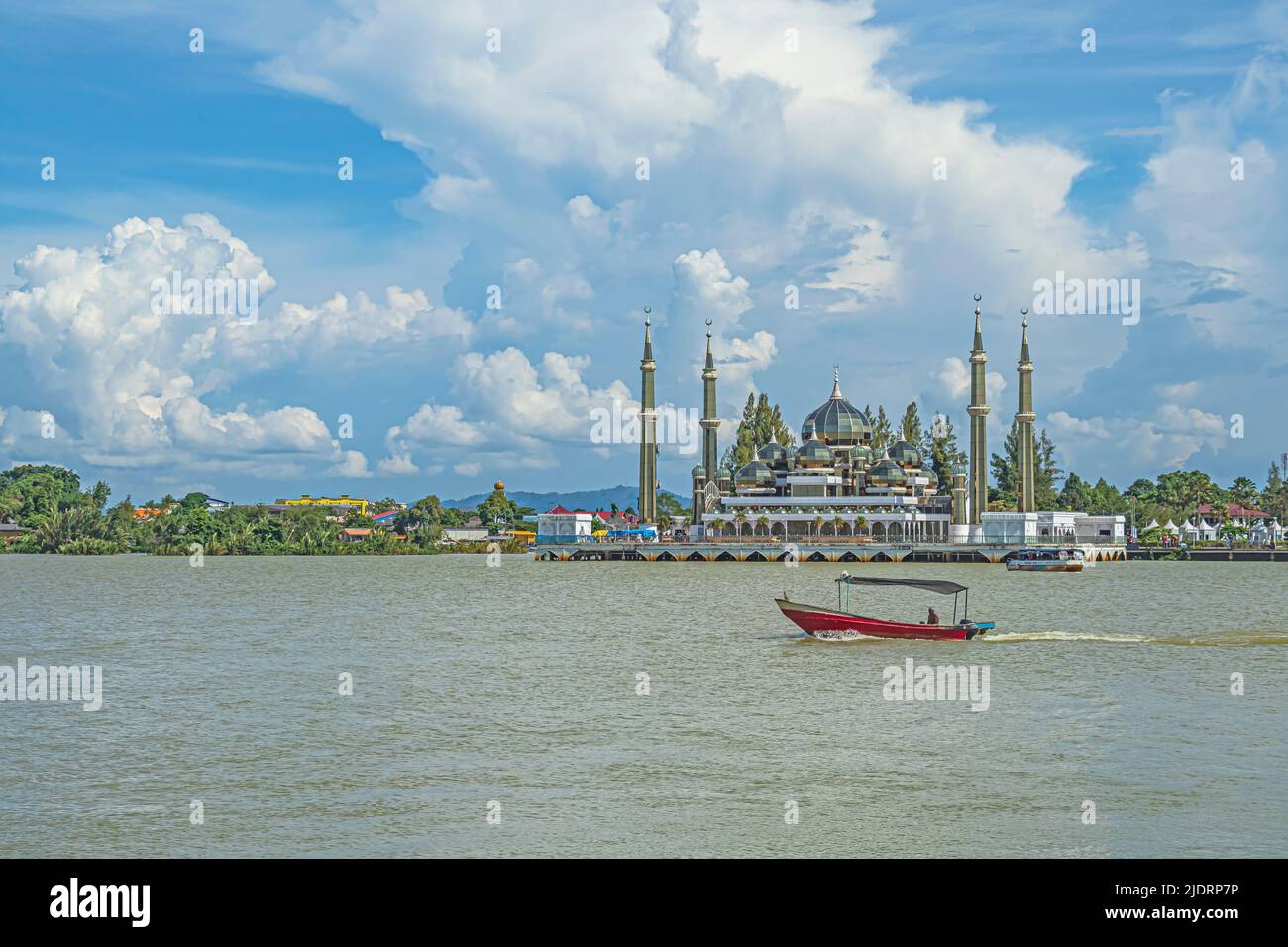 A motorised boat cruising in Sungai Terengganu River with Crystal ...