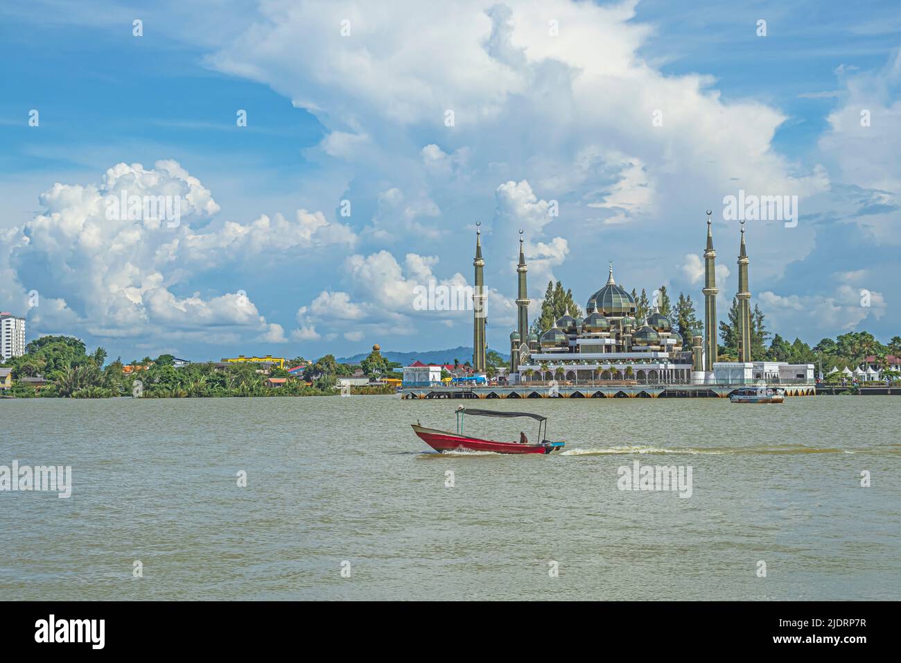 A motorised boat cruising in Sungai Terengganu River with Crystal ...