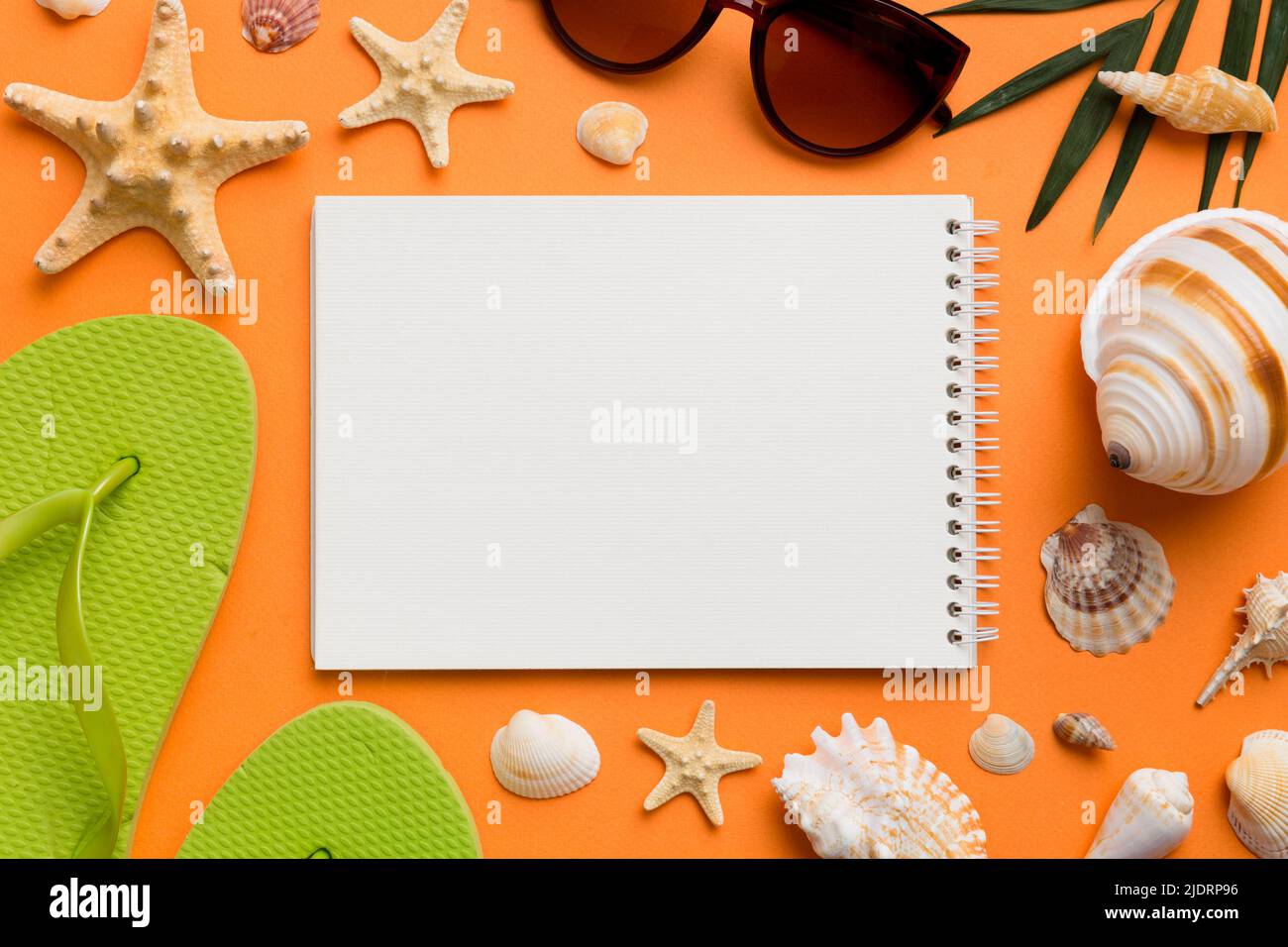 Blank writing book with summer beach accessories on background, copy ...