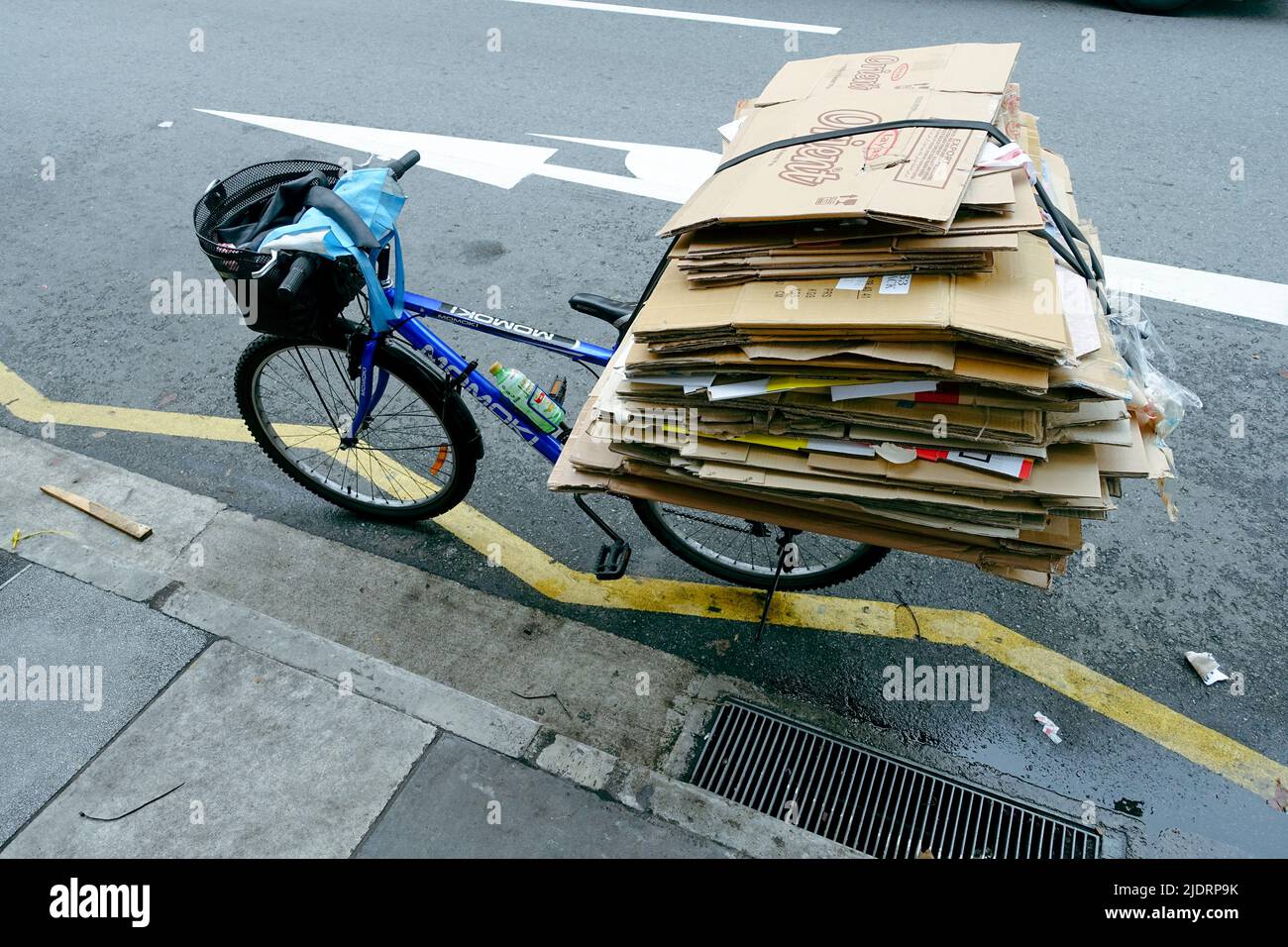 Bike stacked with cardboard for recycling in Singapore Stock Photo - Alamy