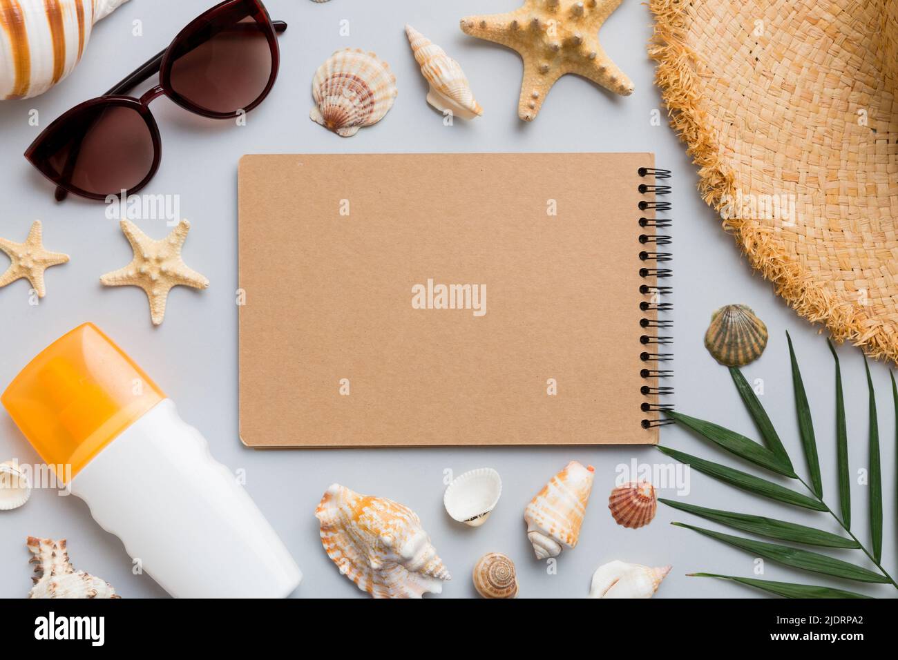 Blank writing book with summer beach accessories on background, copy ...