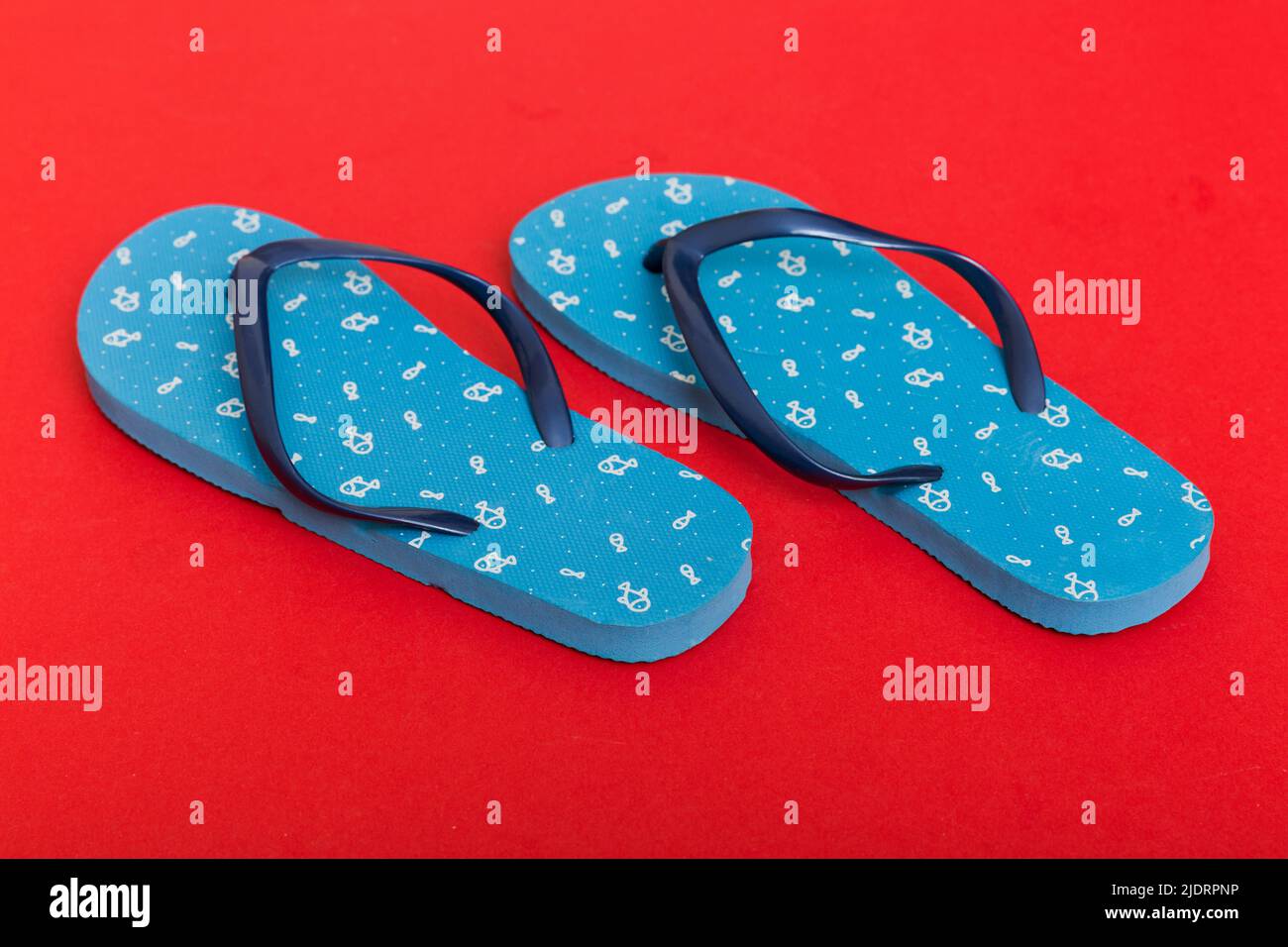 Beach accessories. Flip flops and starfish on colored background. Top ...